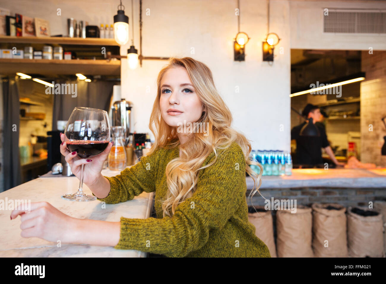 Beautiful woman drinking wine in restaurant Stock Photo - Alamy