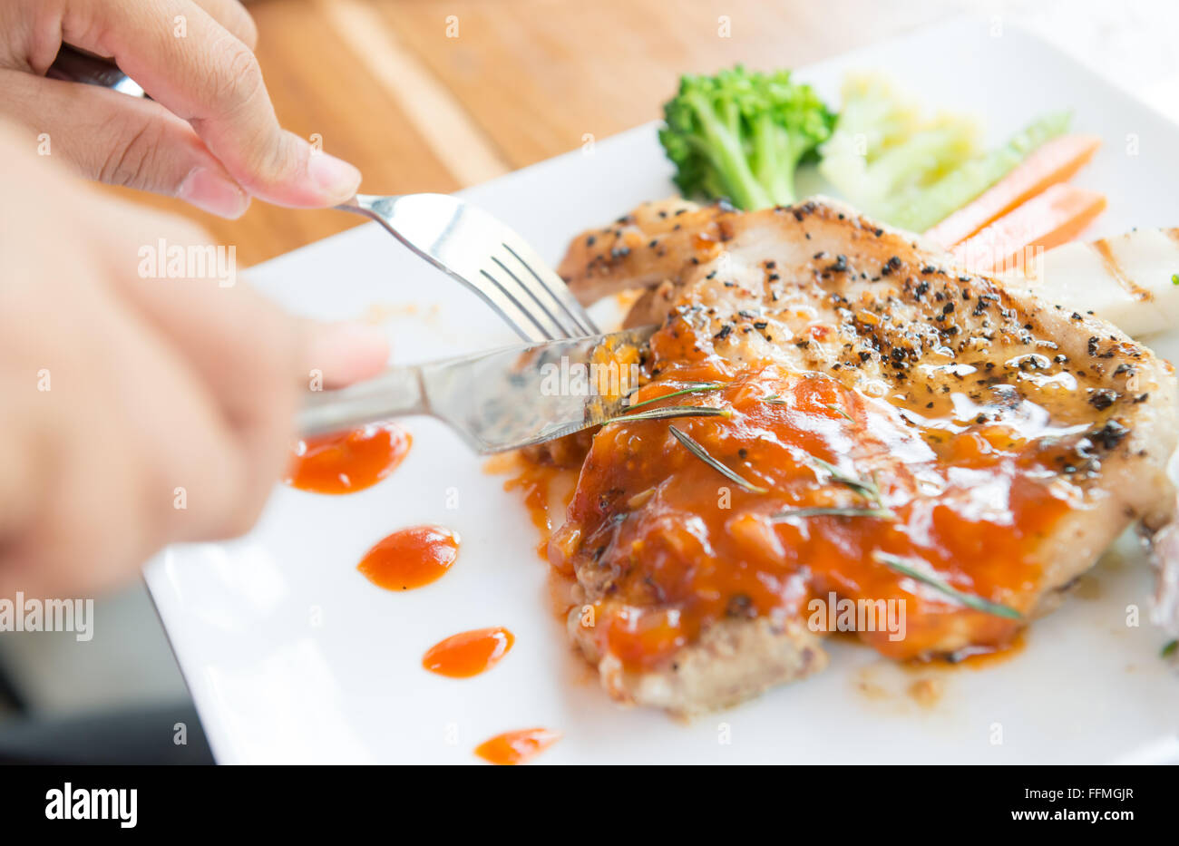 woman eating steak in a restaurant Stock Photo - Alamy