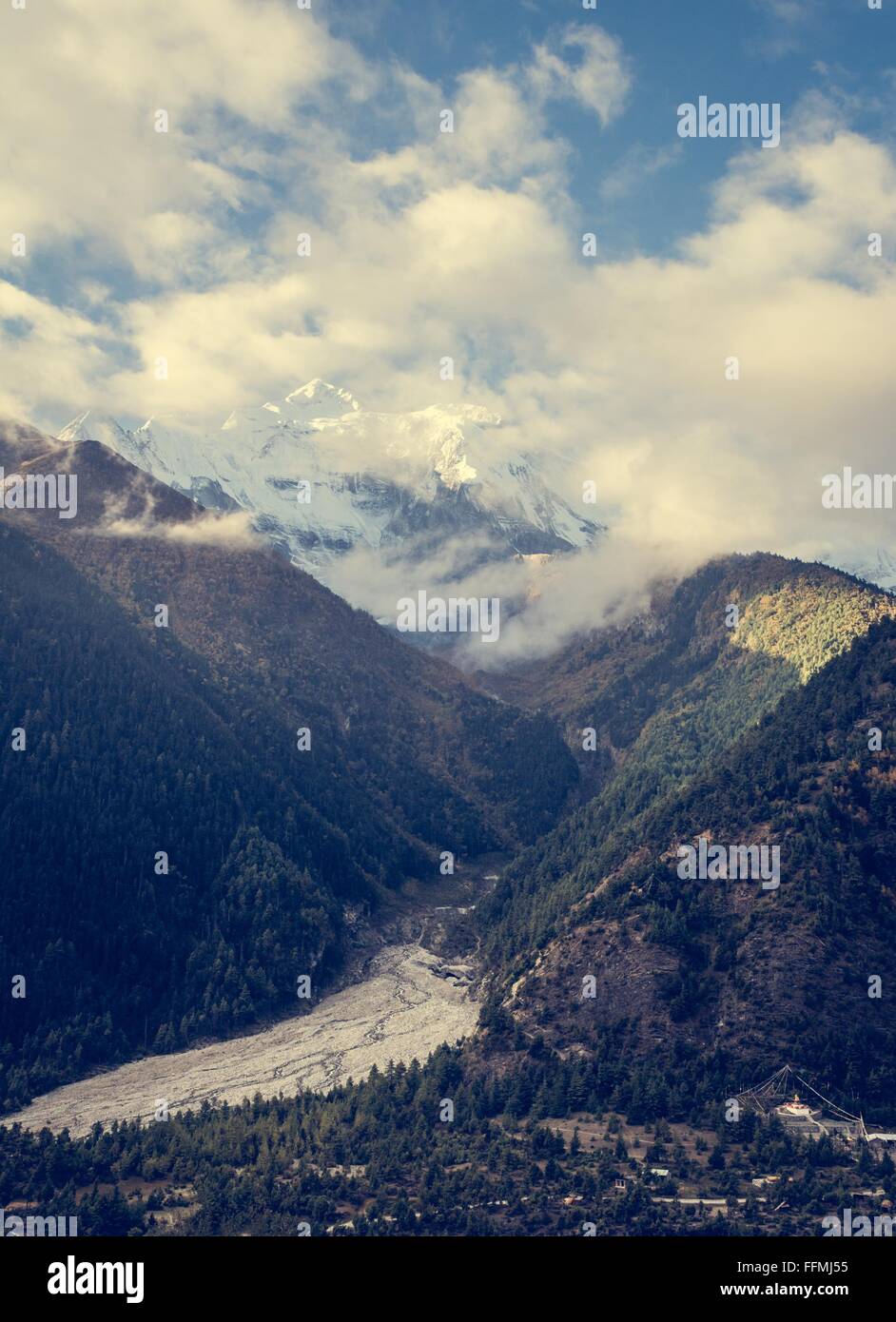 Mountains rising above valley Stock Photo - Alamy