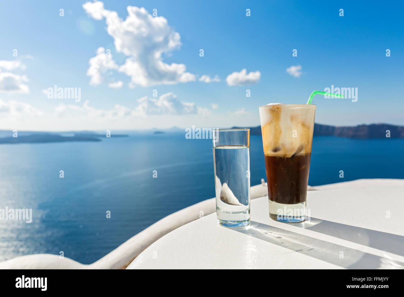 Refreshing cocktail and a glass of cold water near the sea Stock Photo ...