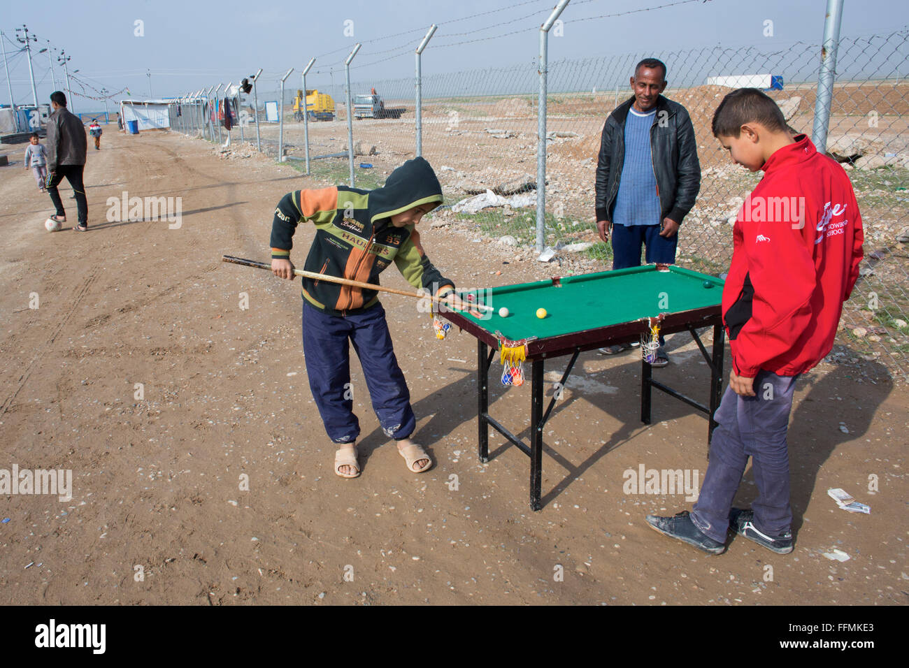 playing pool in Salarara refugee camp, Iraq Stock Photo - Alamy