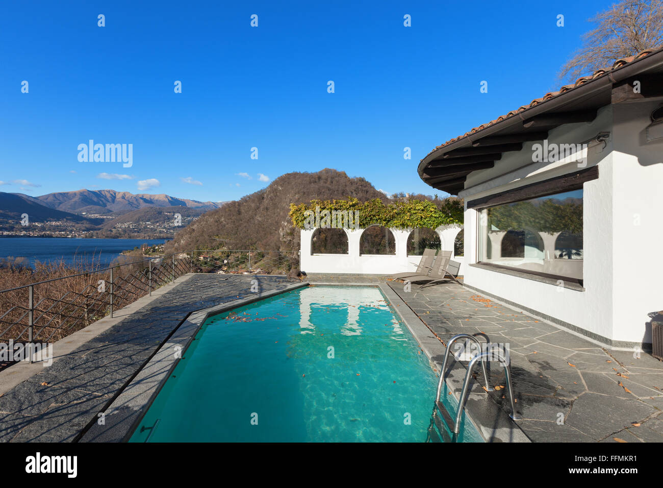 beautiful terrace with pool of a villa, lake view Stock Photo - Alamy