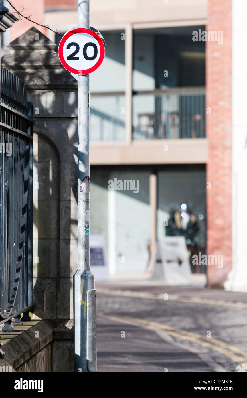 Twenty mile per hour speed limit sign reminder on a lampost in a city ...