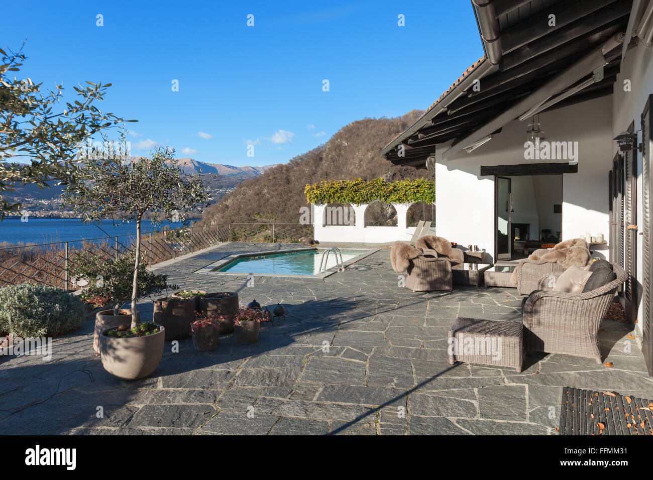 beautiful terrace with pool of a villa, lake view Stock Photo - Alamy