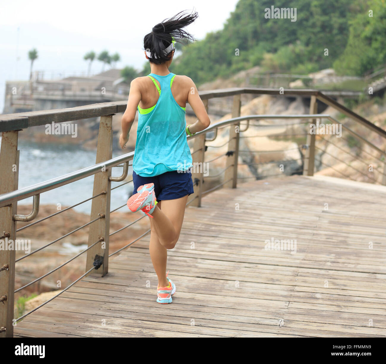 fitness sports woman running on wooden boardwalk seaside Stock Photo ...