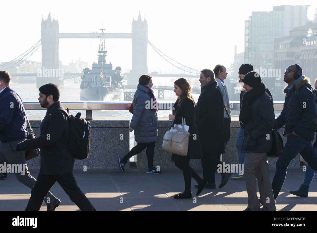 People crossing London Bridge at frosty morning rush hours, London ...