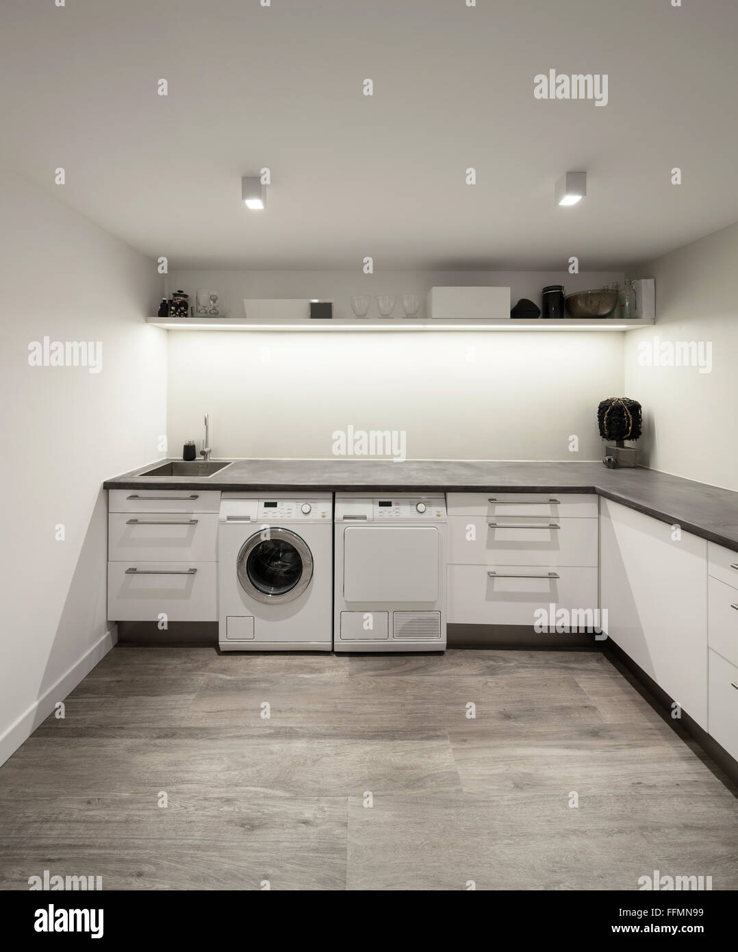 Interior of house, laundry with wooden floor Stock Photo - Alamy