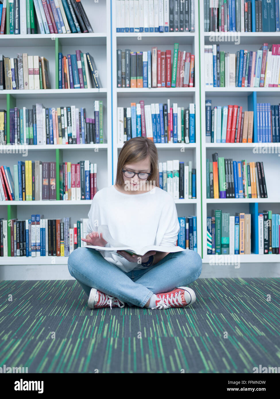 student girl in collage school library reading book Stock Photo - Alamy