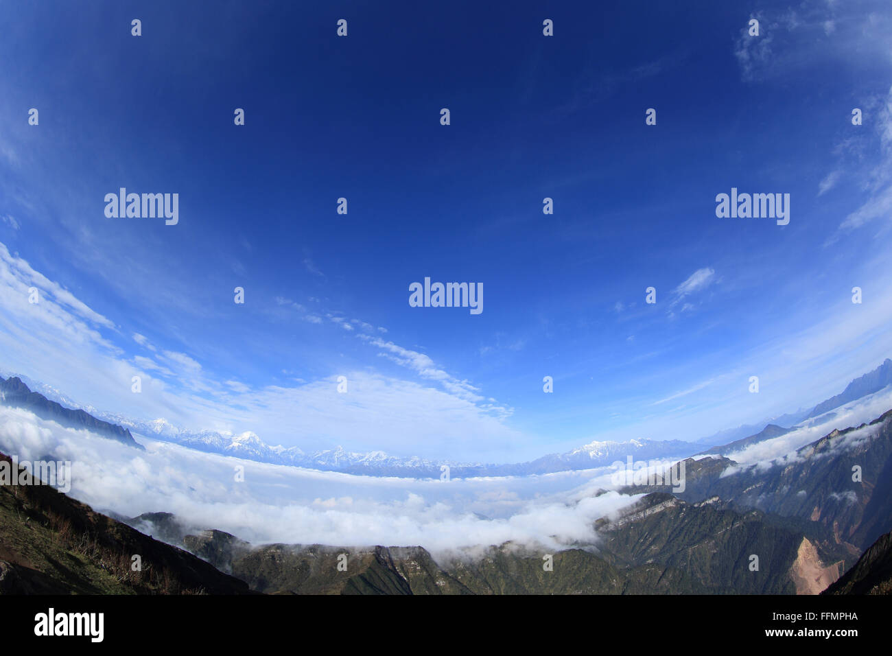 beautiful rolling clouds and frozen mountain summits landscape Stock ...