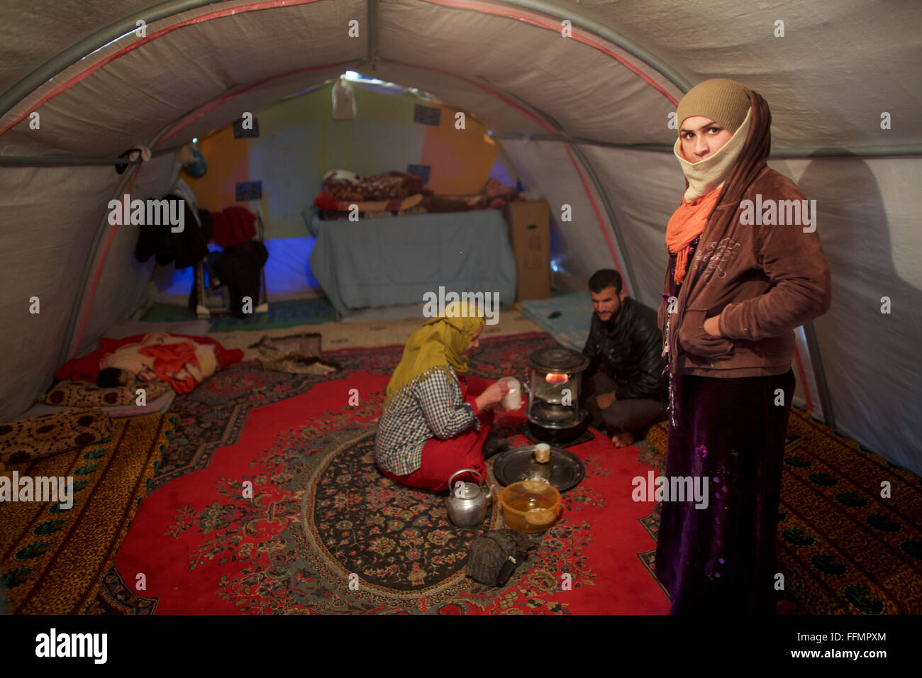 Refugee woman inside tent in hi-res stock photography and images - Alamy