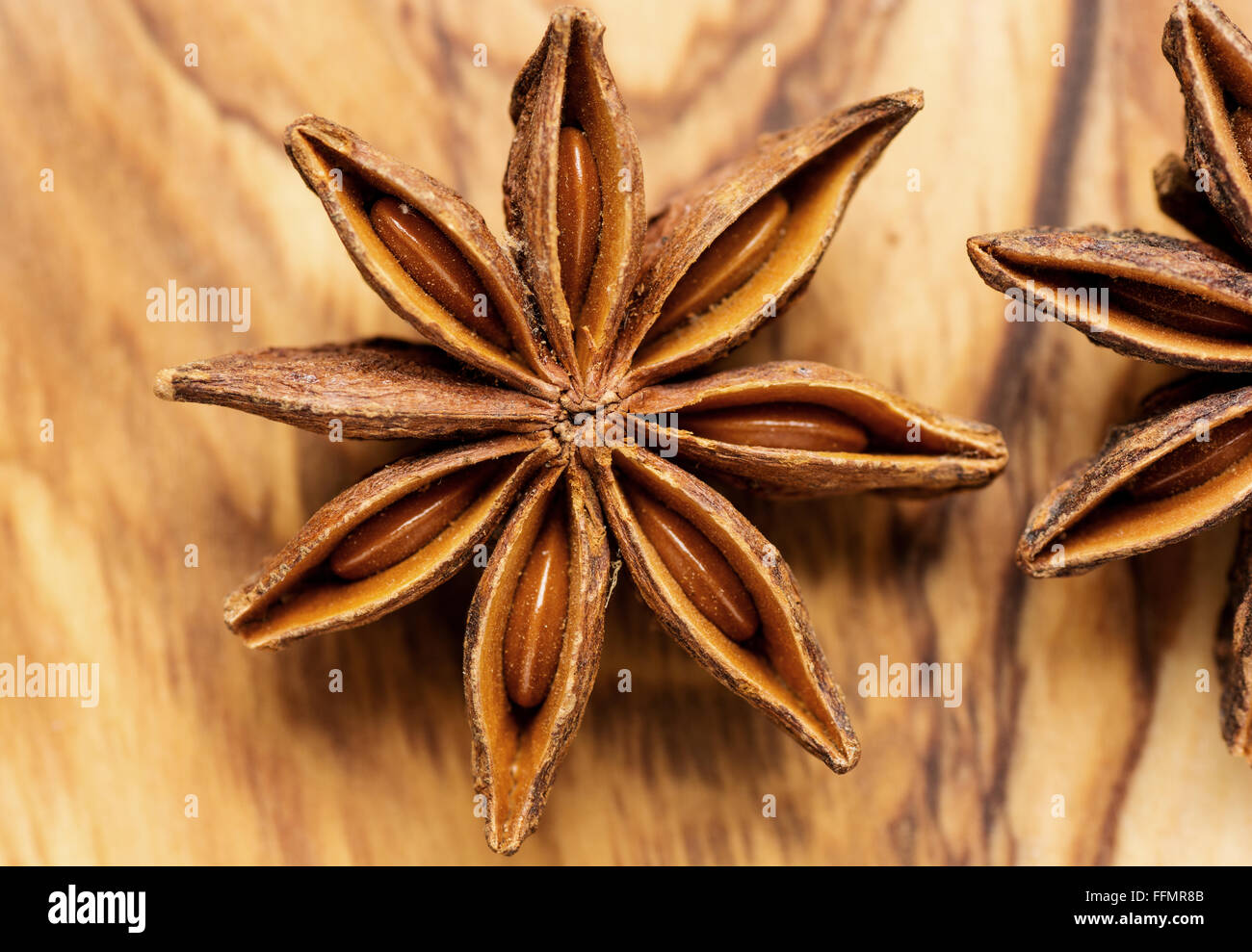 Star anise on wooden table Stock Photo - Alamy