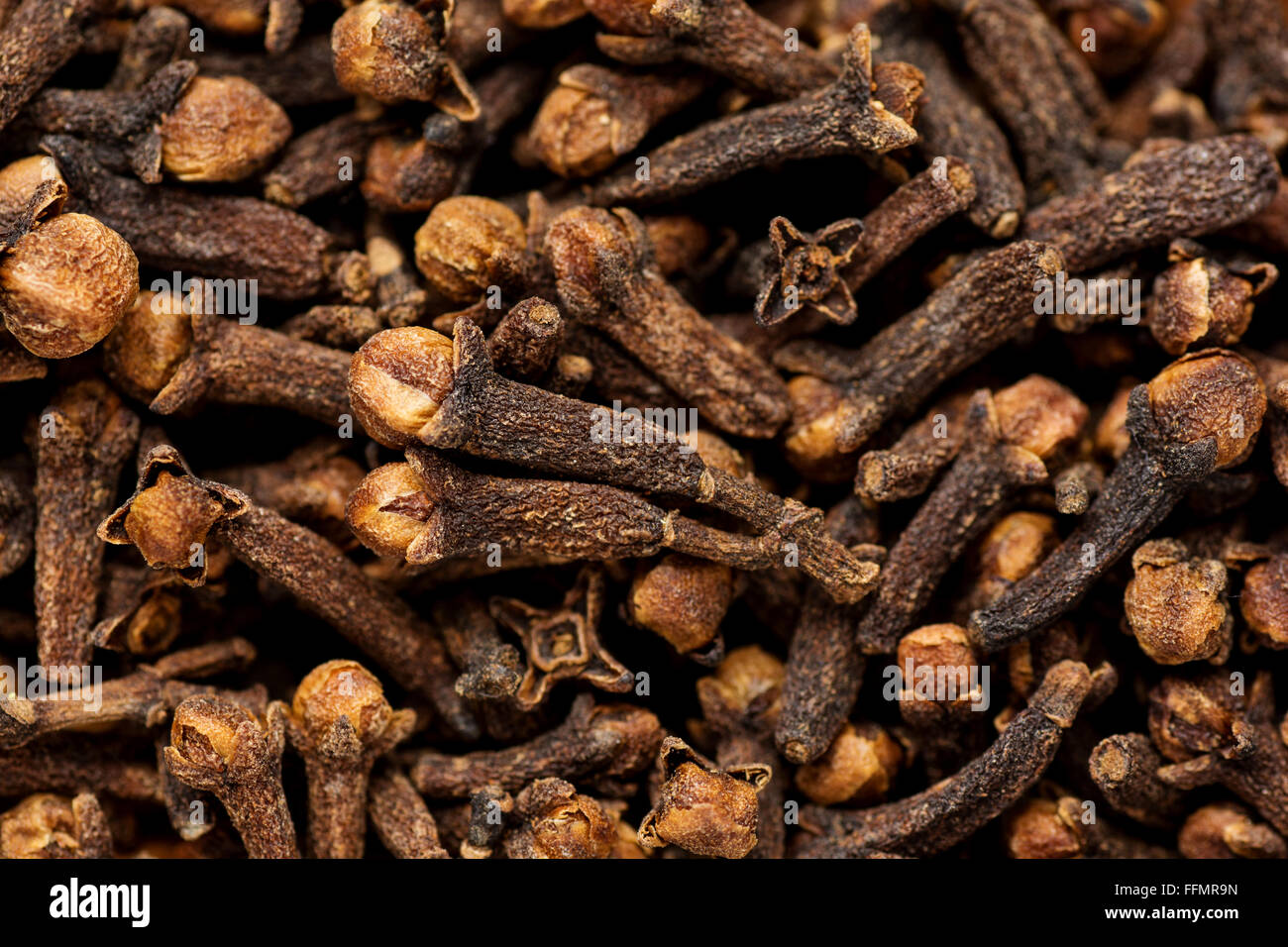 freshly dryed clove spice texture close up Stock Photo - Alamy