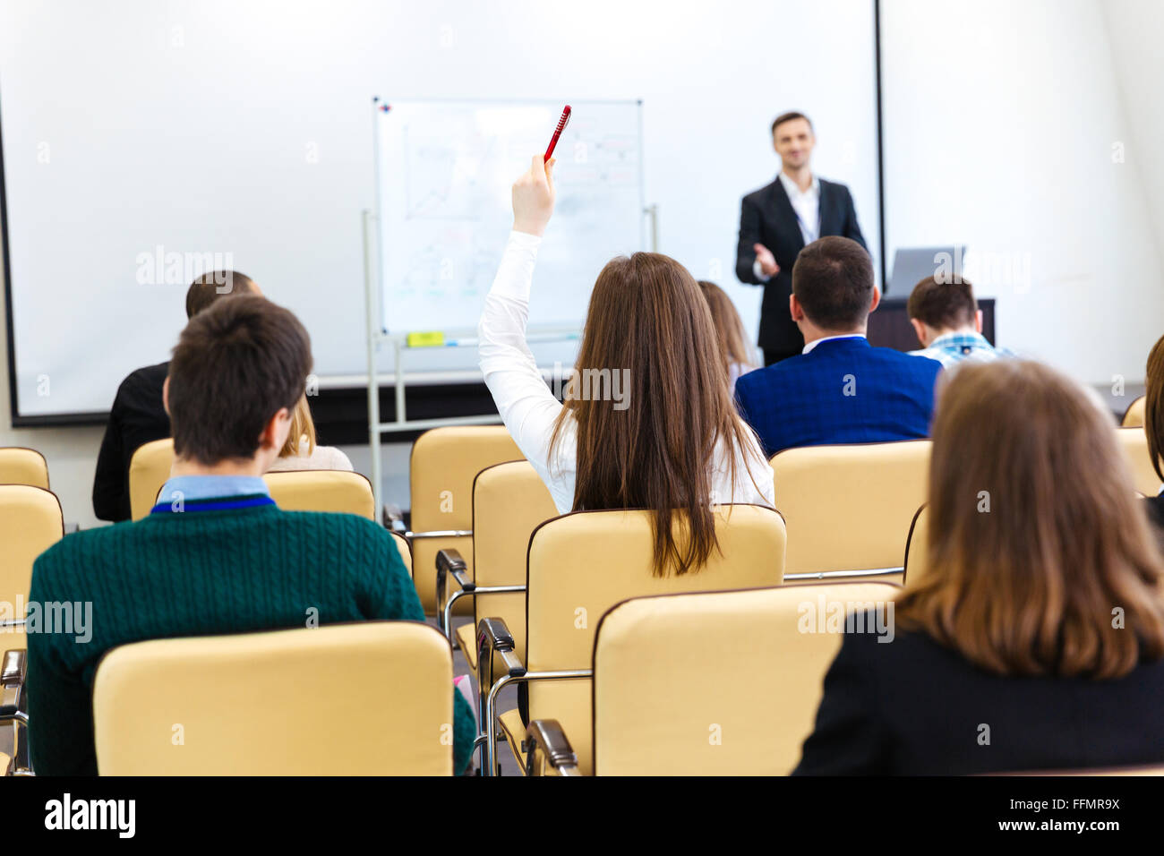 Speaker talking to audience and answering the questions on business ...