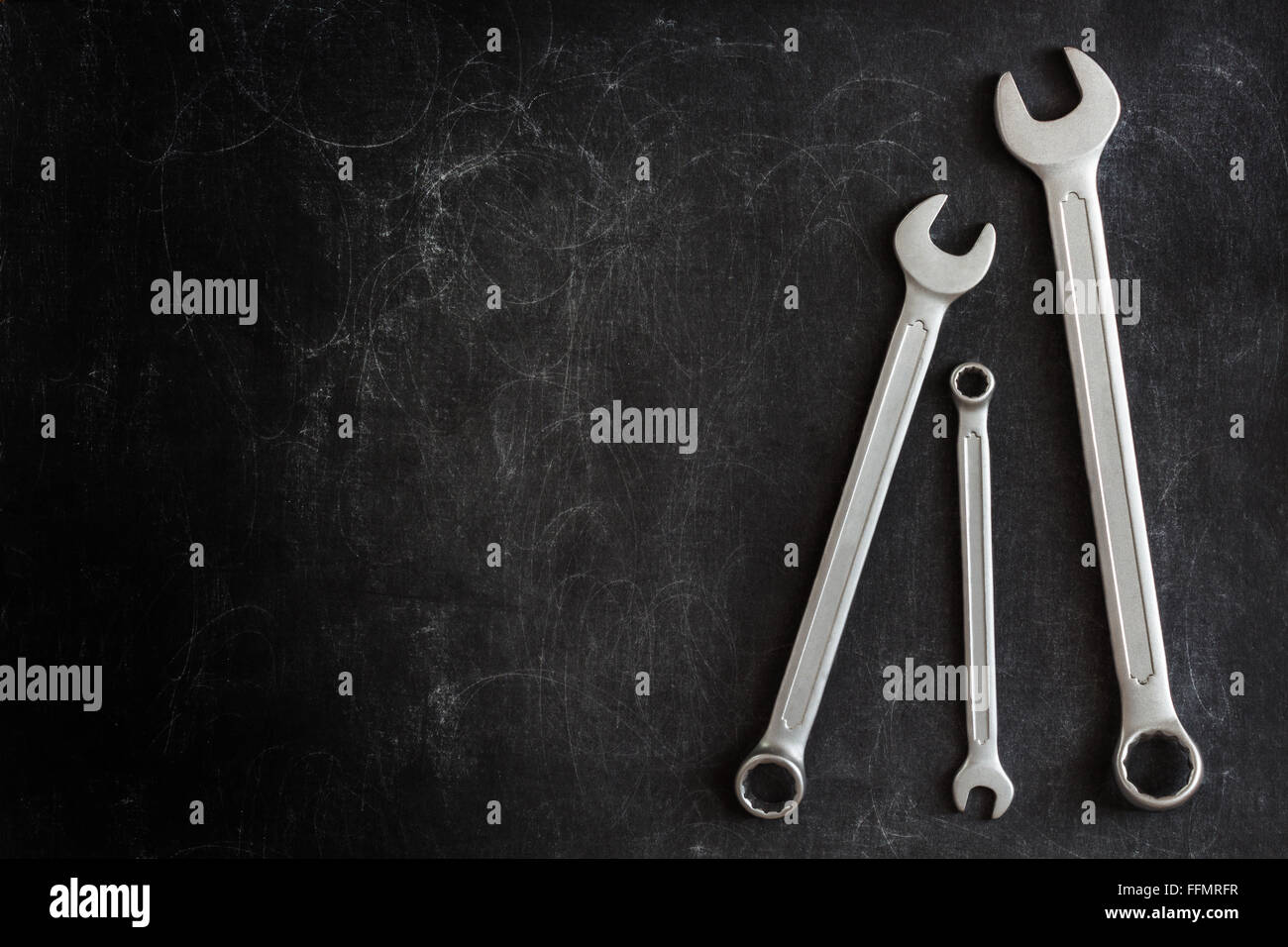 Set of 3 Wrenches on a Dark Textured Background Stock Photo - Alamy