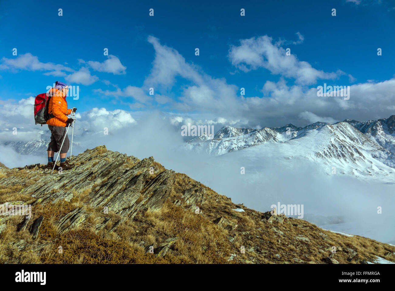 Female walker hiker in Pyrenees mountains in clouds Stock Photo - Alamy