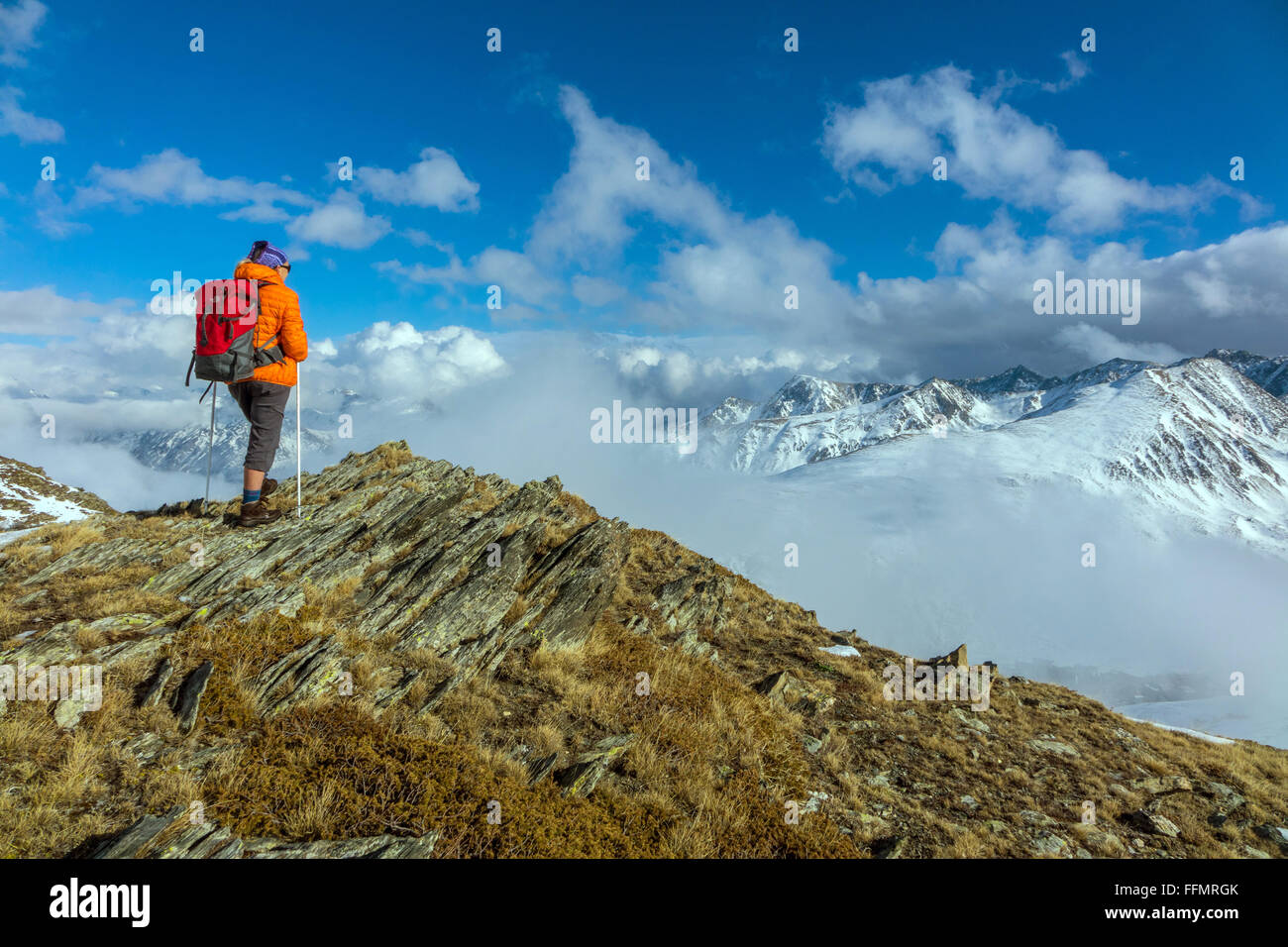 Female walker hiker in Pyrenees mountains in clouds Stock Photo - Alamy