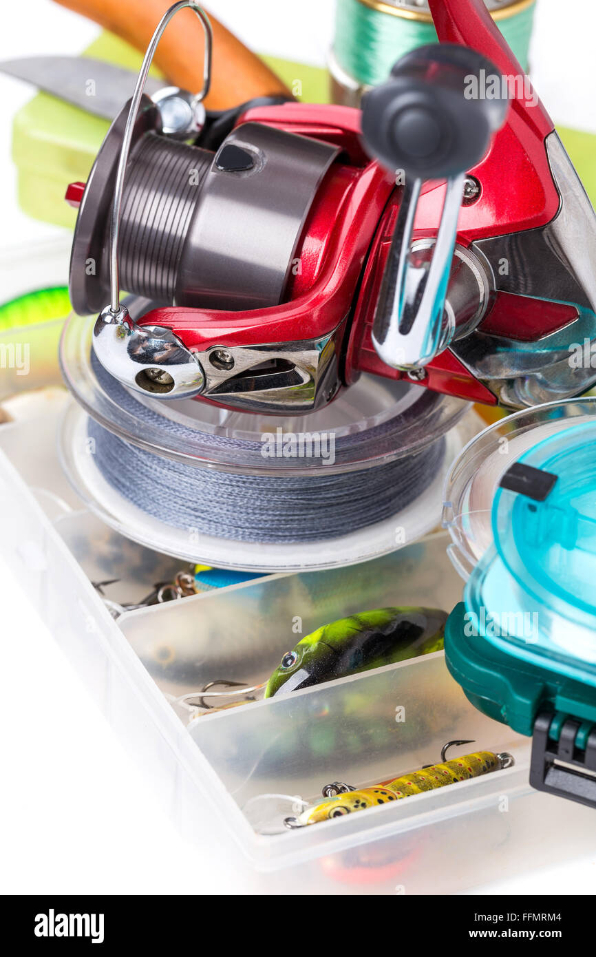 fishing tackles and baits in storage boxes with reel and spool of line ...