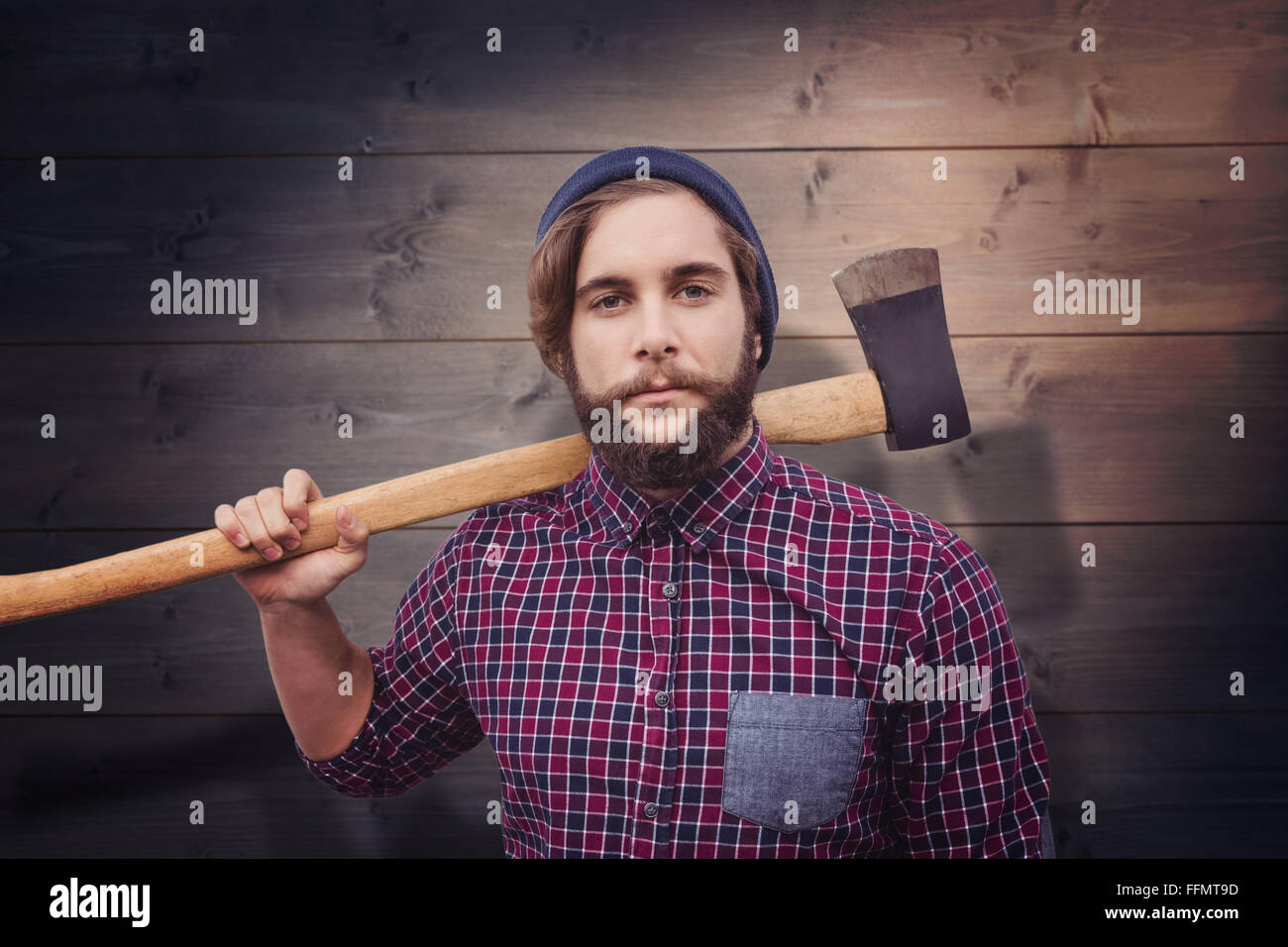 Composite image of hipster holding axe on shoulder Stock Photo - Alamy