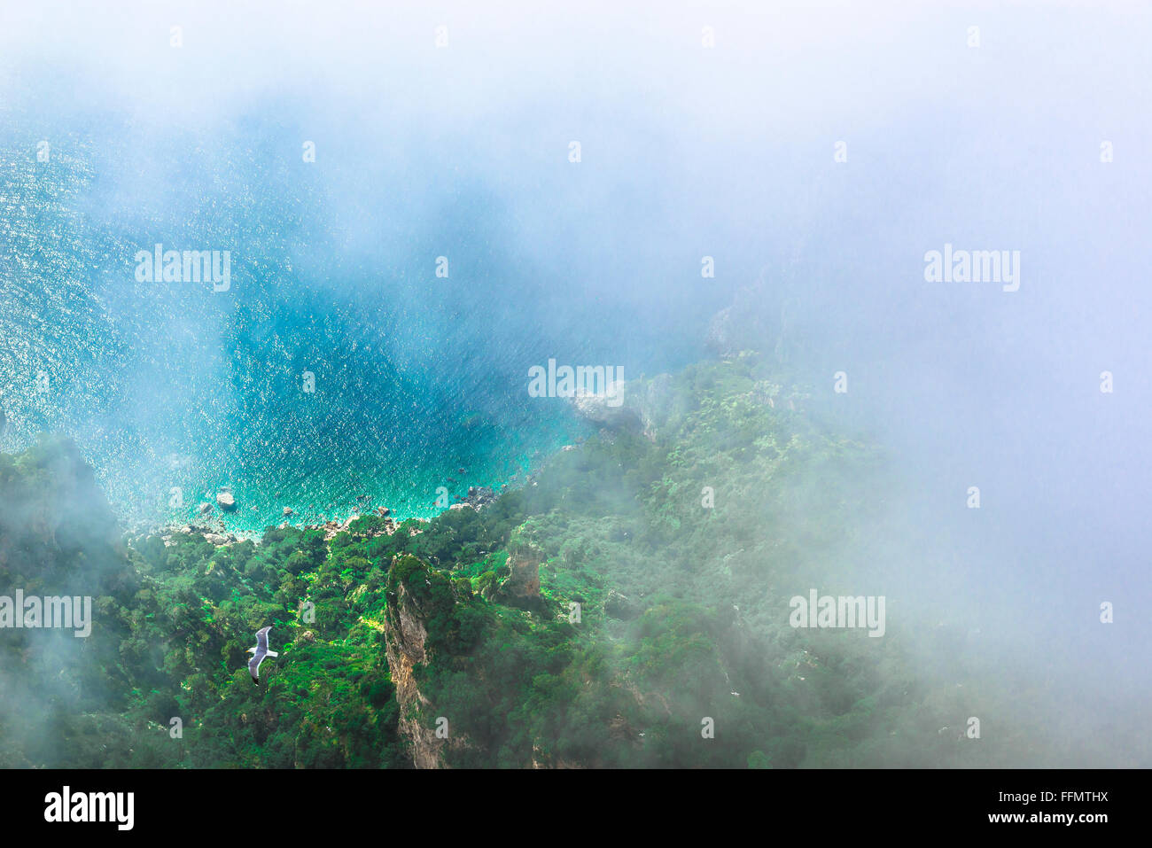 Capri coast, view from the cloud-topped cliff alongside Monte Solaro ...