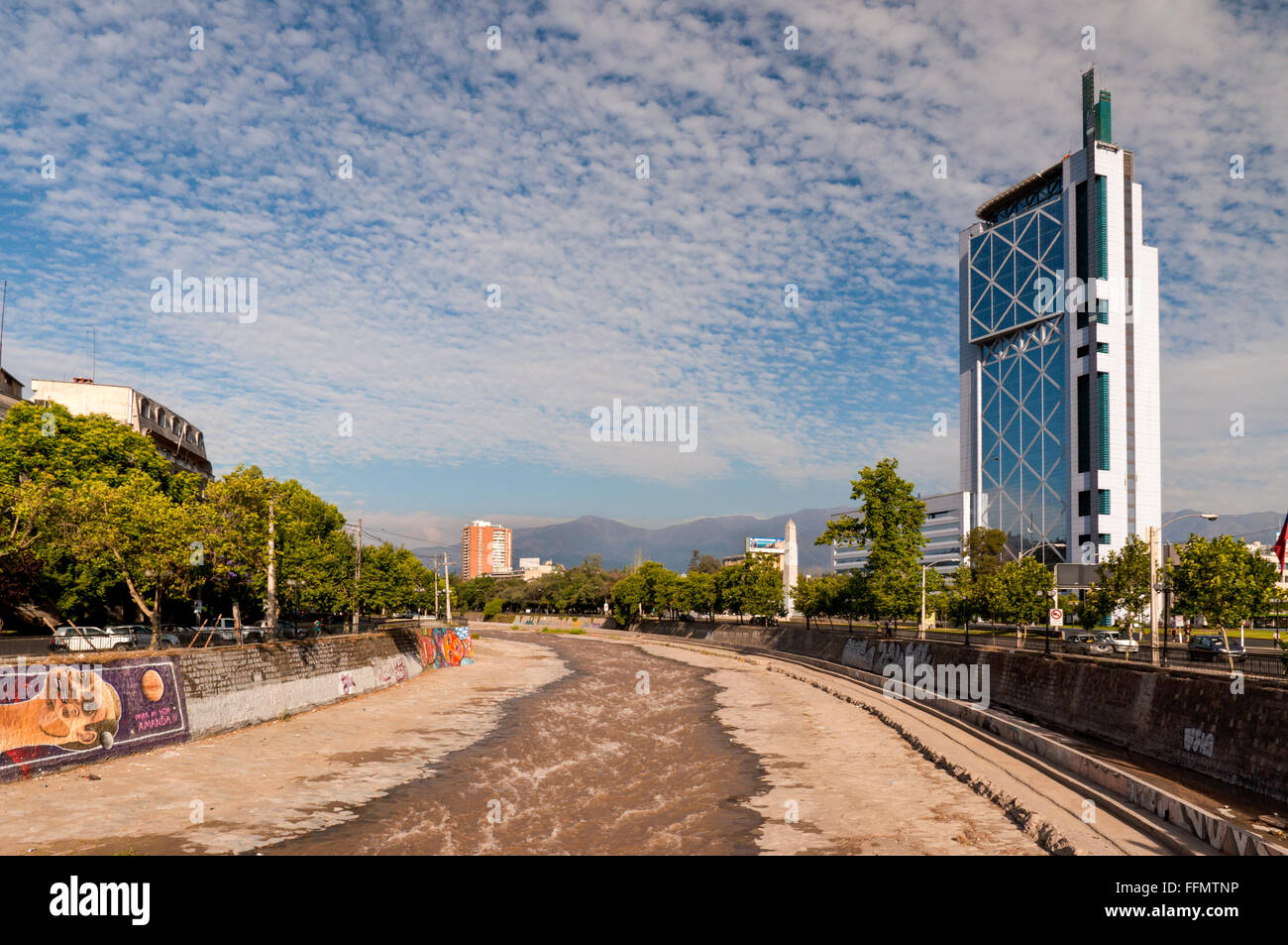 View of Torre Telefonica Building on the shore of Mapocho River ...