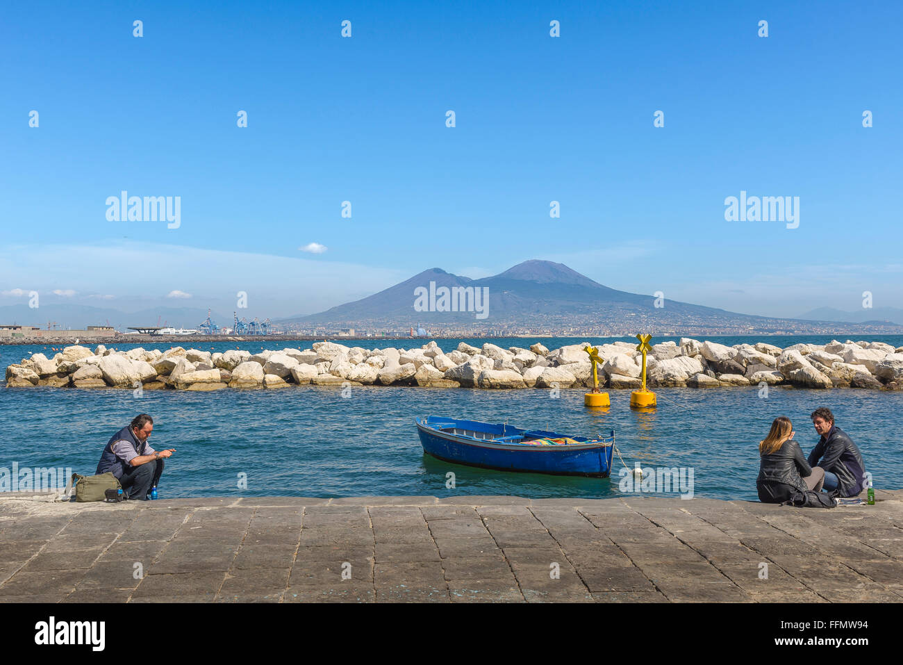 Bay Naples Italy, view of people relaxing along the waterfront in the ...