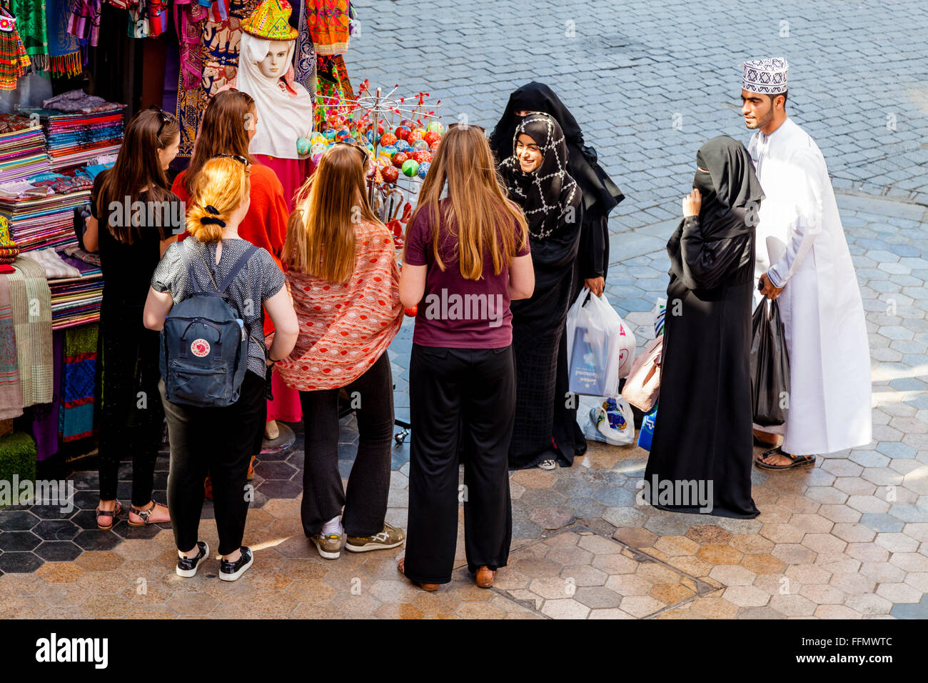 Young Female Tourists Chatting With Local Omani Women, Muttrah Souk ...