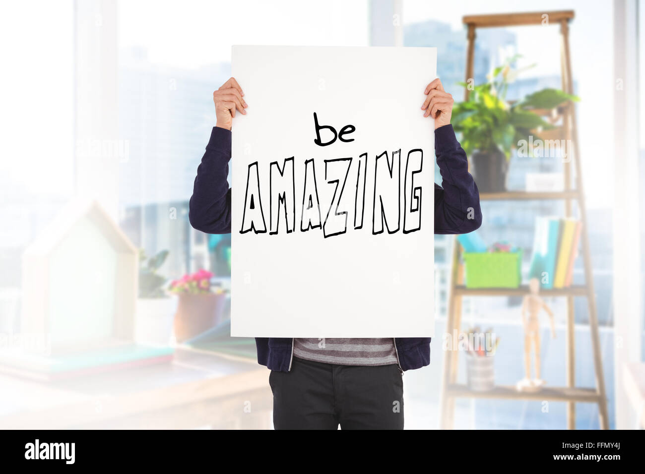 Composite image of man showing billboard in front of face Stock Photo ...