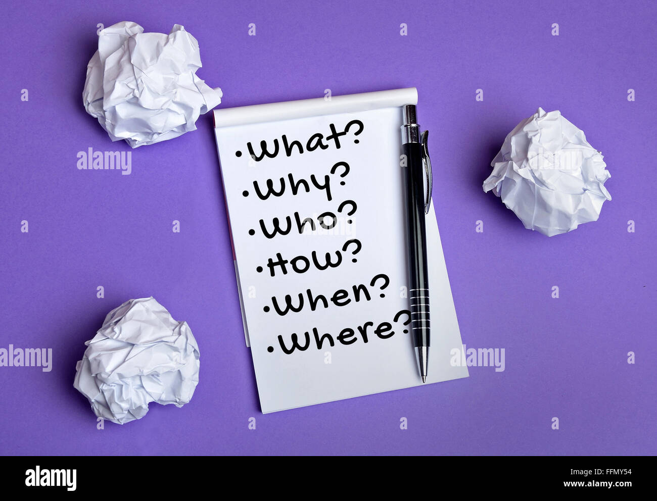 Many question on note pad Stock Photo - Alamy