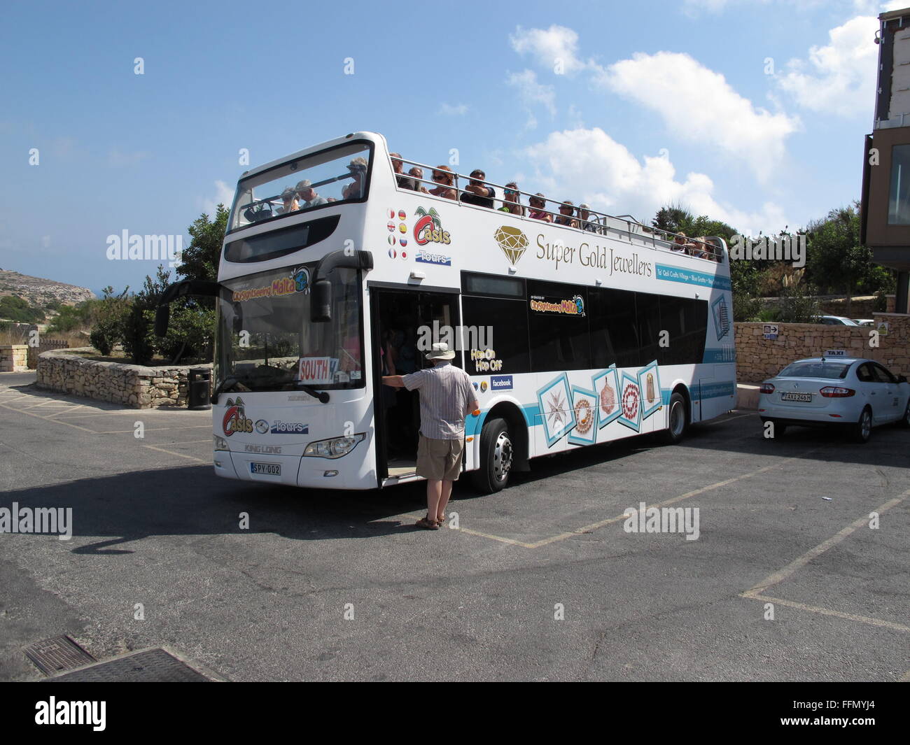 A modern Sighseeing bus in Malta Stock Photo - Alamy