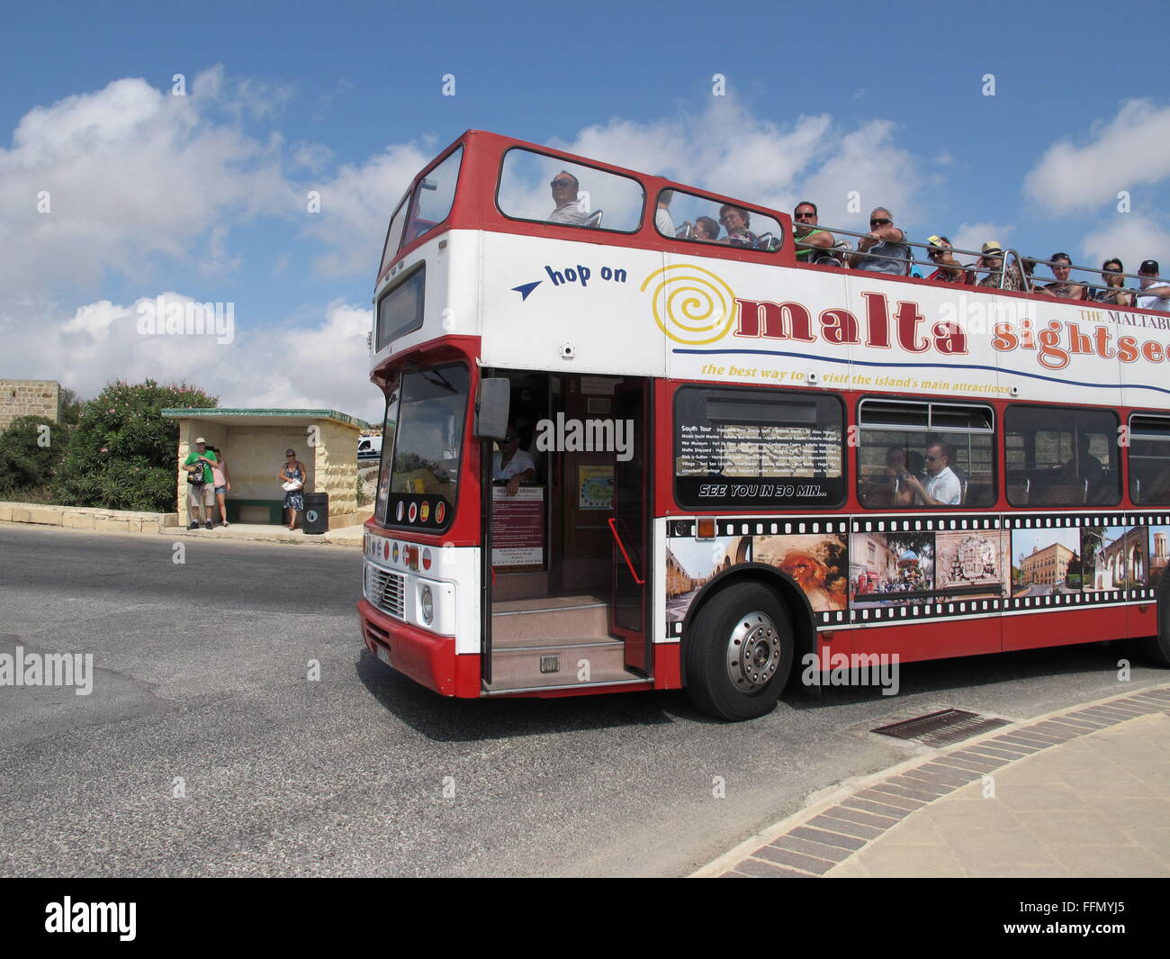 A modern Sighseeing bus in Malta Stock Photo - Alamy