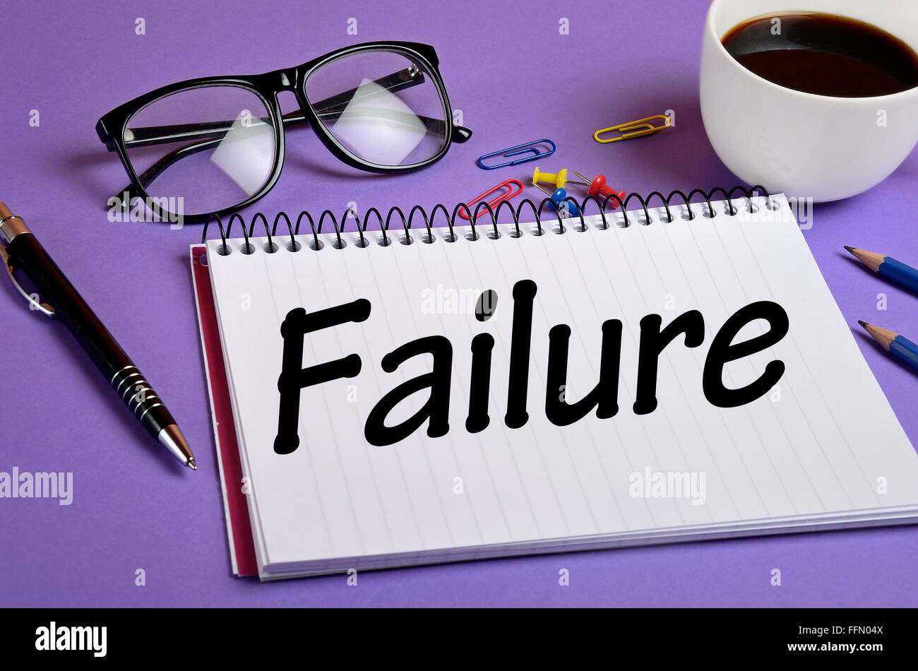 Failure word on notepad closeup Stock Photo - Alamy