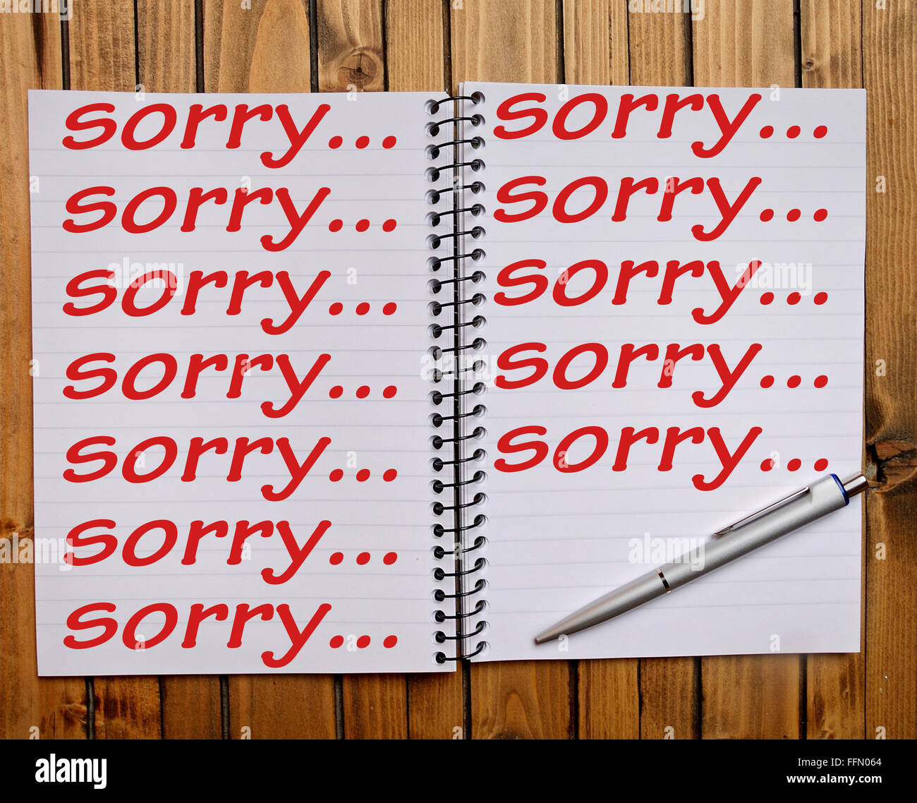 Sorry word on note pad Stock Photo - Alamy
