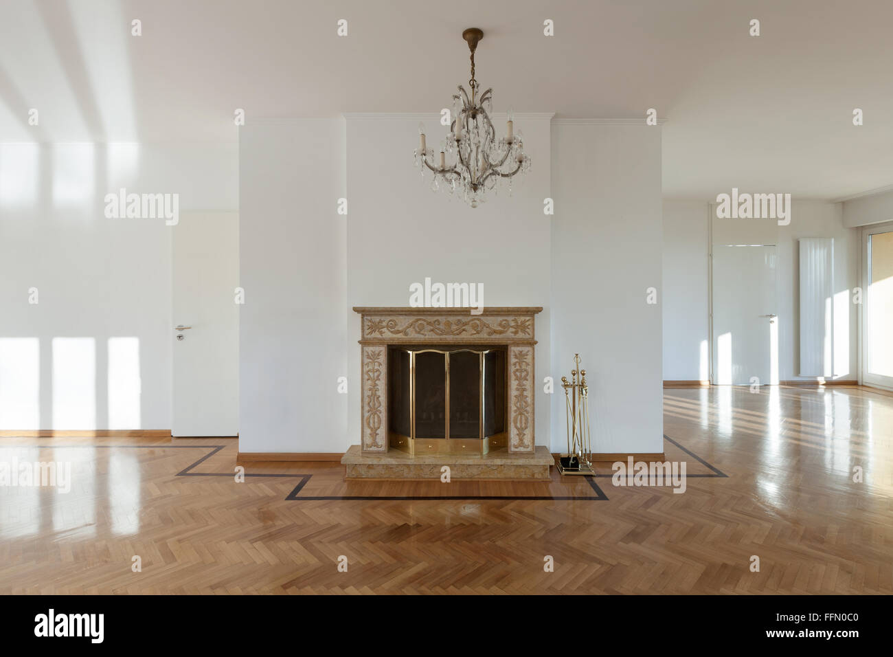 interior of an house, empty big room with fireplace, parquet floor and ...