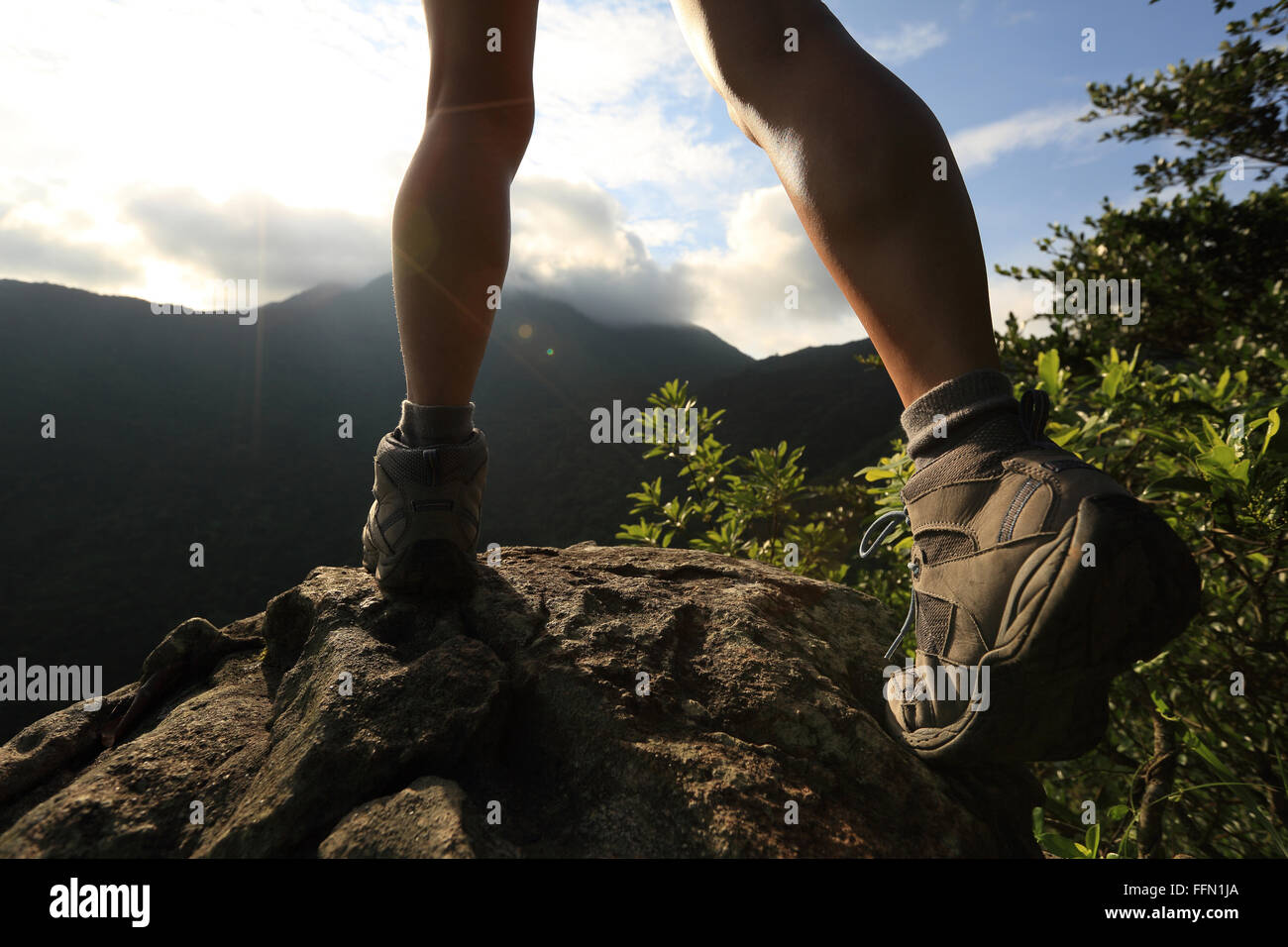 young hiker legs hiking on mountain peak Stock Photo - Alamy