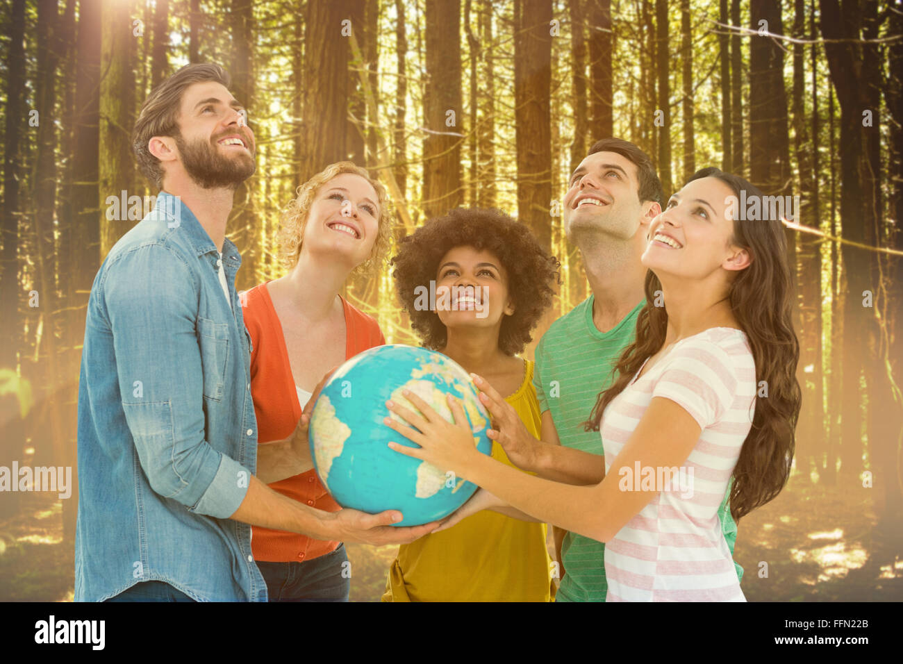 Composite image of young creative business people with a globe Stock ...