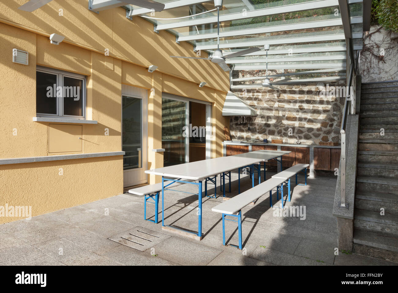 architecture, veranda with table and benchs, outside Stock Photo - Alamy