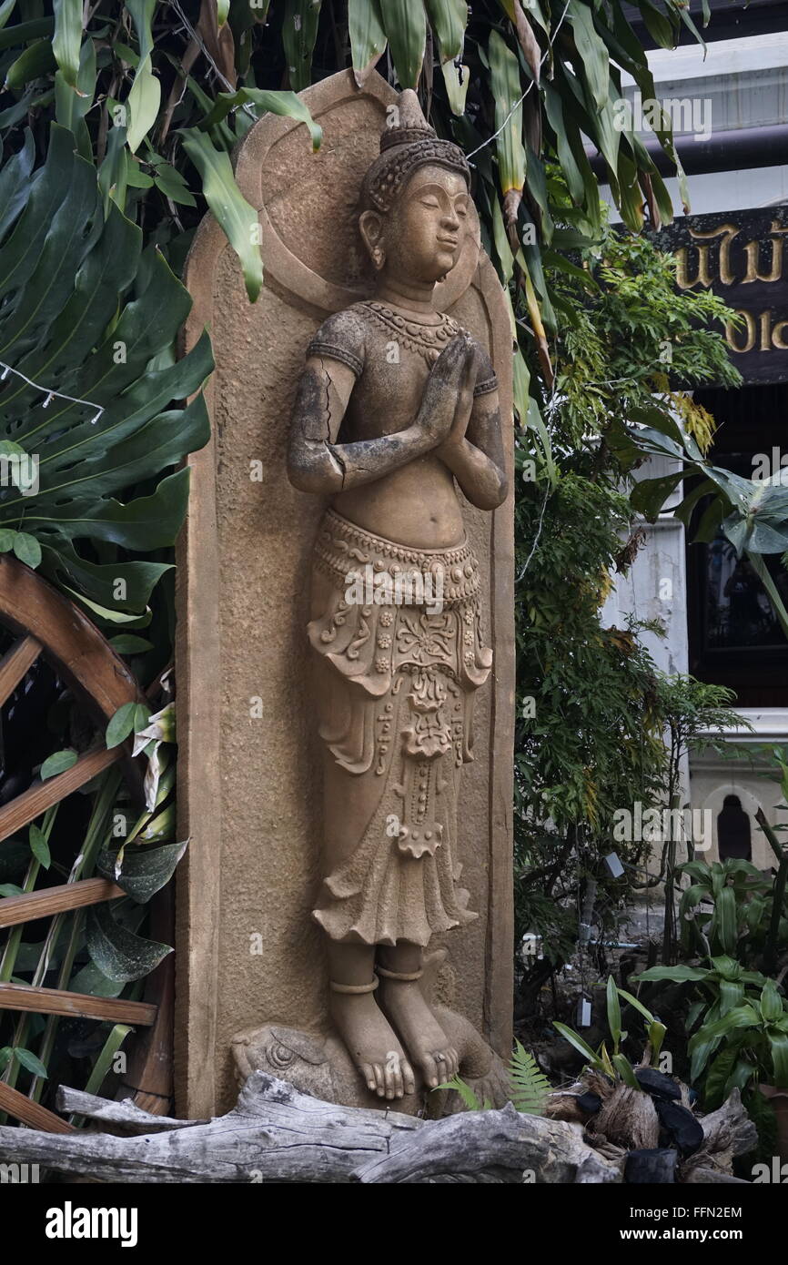 Thai standing and greeting Buddhist monk statue Stock Photo - Alamy