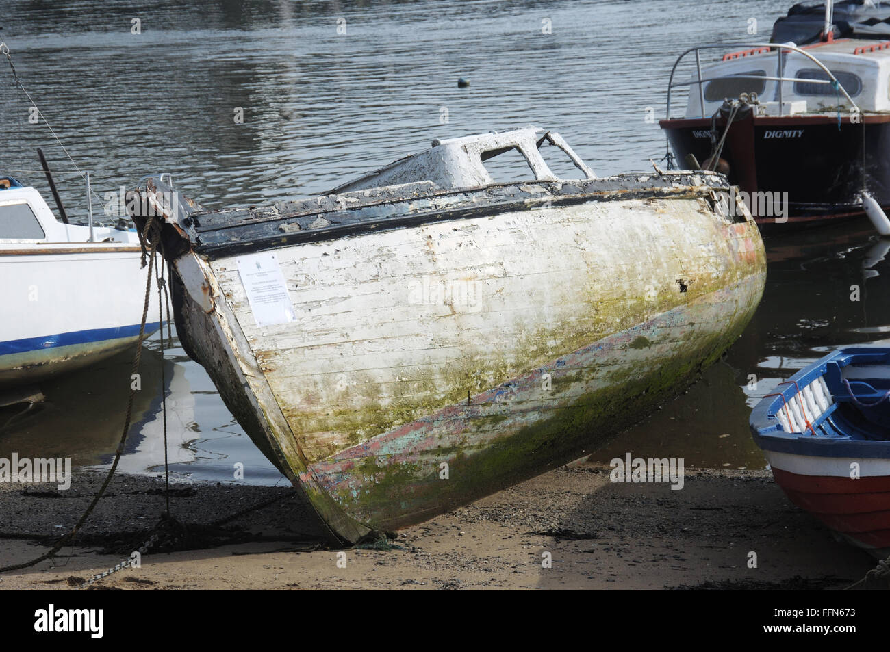Wreck. Old and decrepit boat pulled onto land. You would not want to ...