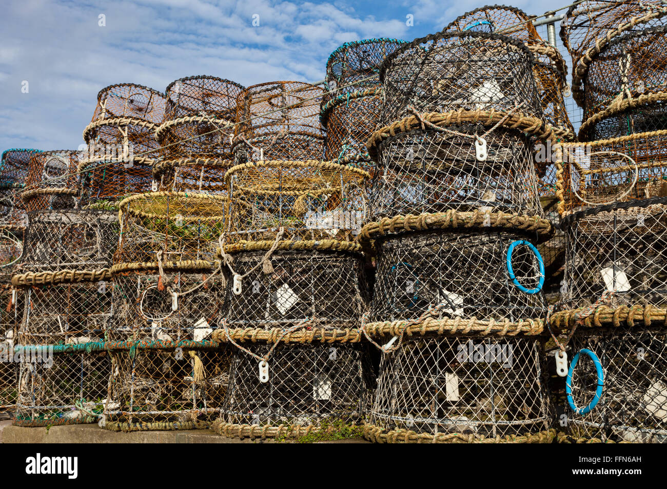 Lobster/crab fishing pots stacked at Brixham Harbour in Devon Stock ...