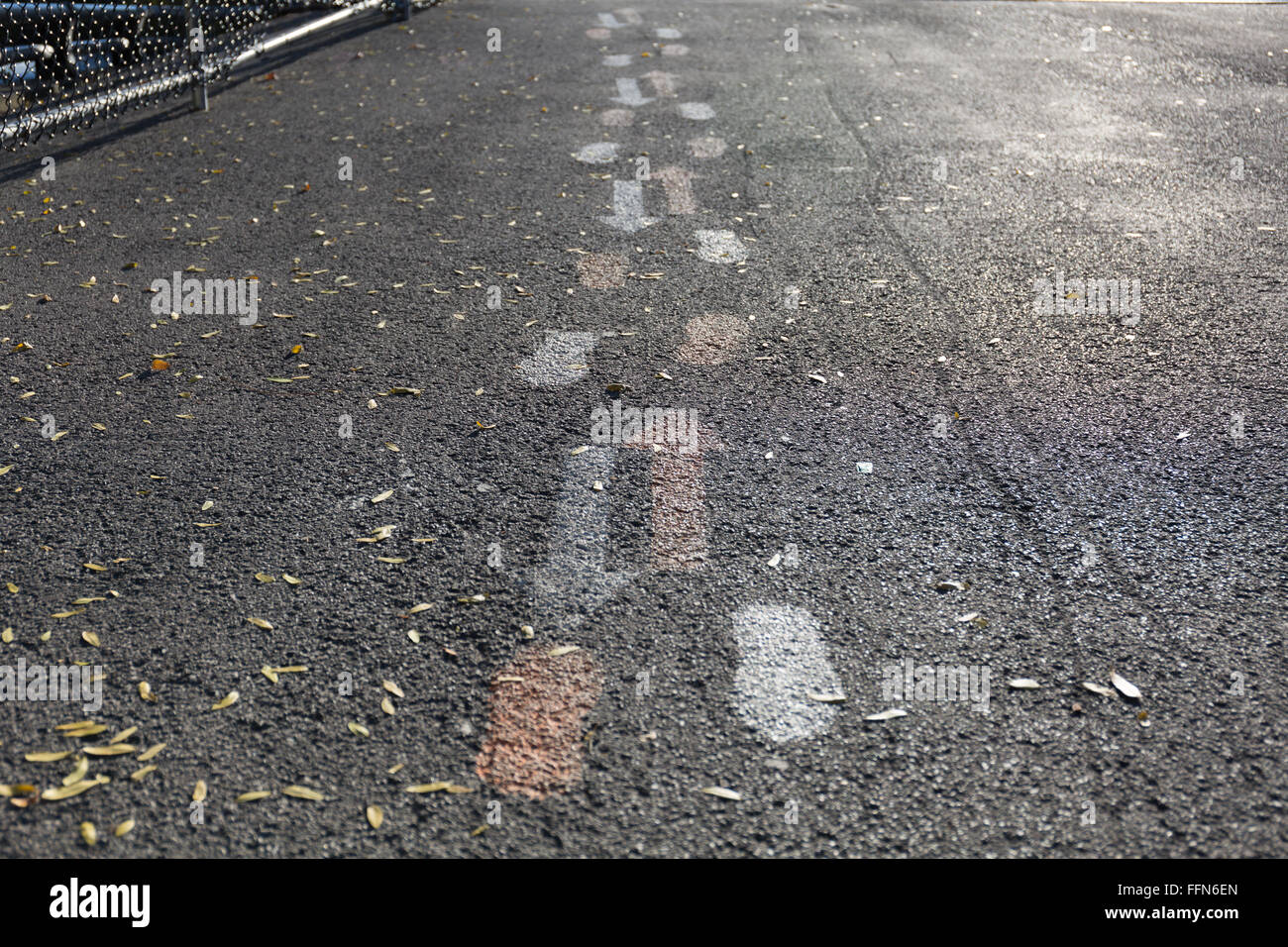 Painted footprints and arrows Stock Photo - Alamy
