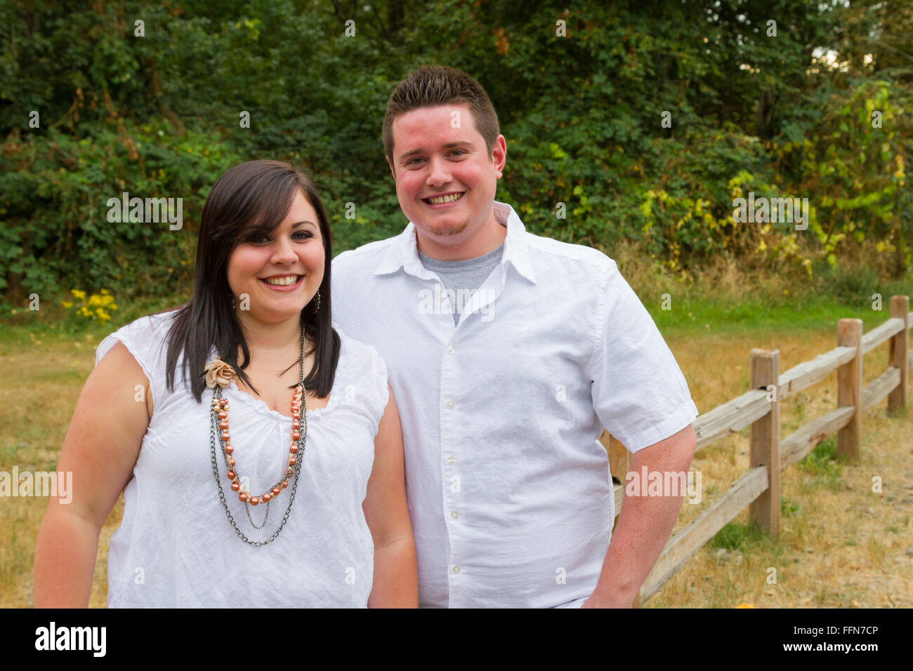 Engaged couple outdoors in a color portrait in Oregon showing the two ...