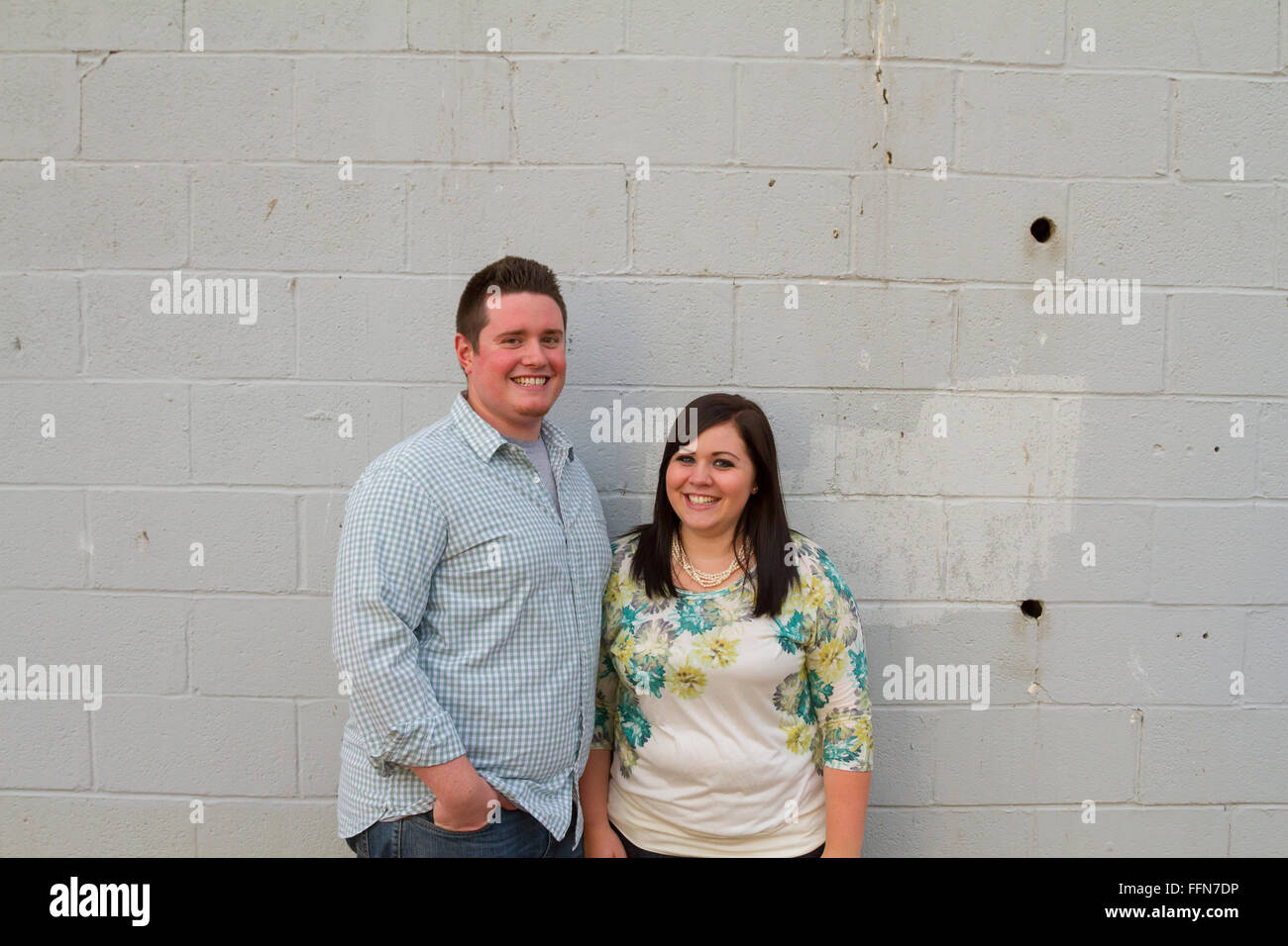 Engaged couple outdoors in a color portrait in Oregon showing the two ...