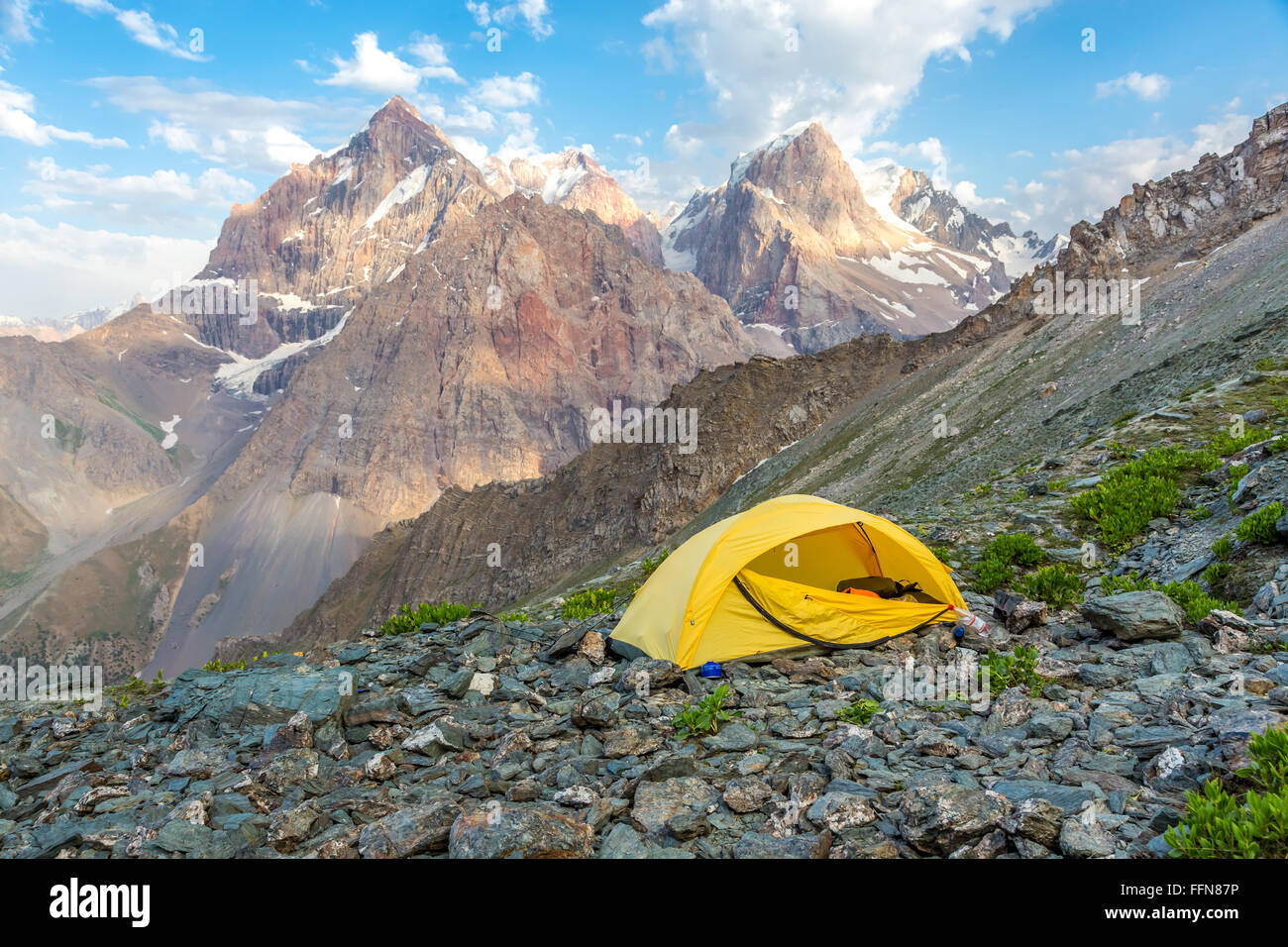 Yellow tent on mountain landscape Stock Photo - Alamy