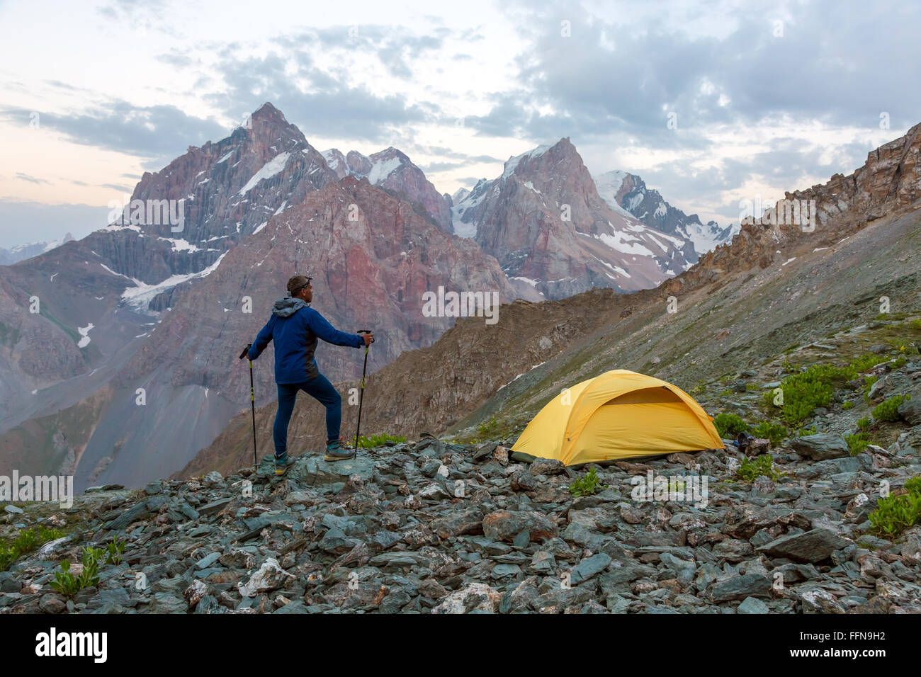Hiker camping tent and mountain landscape Stock Photo - Alamy