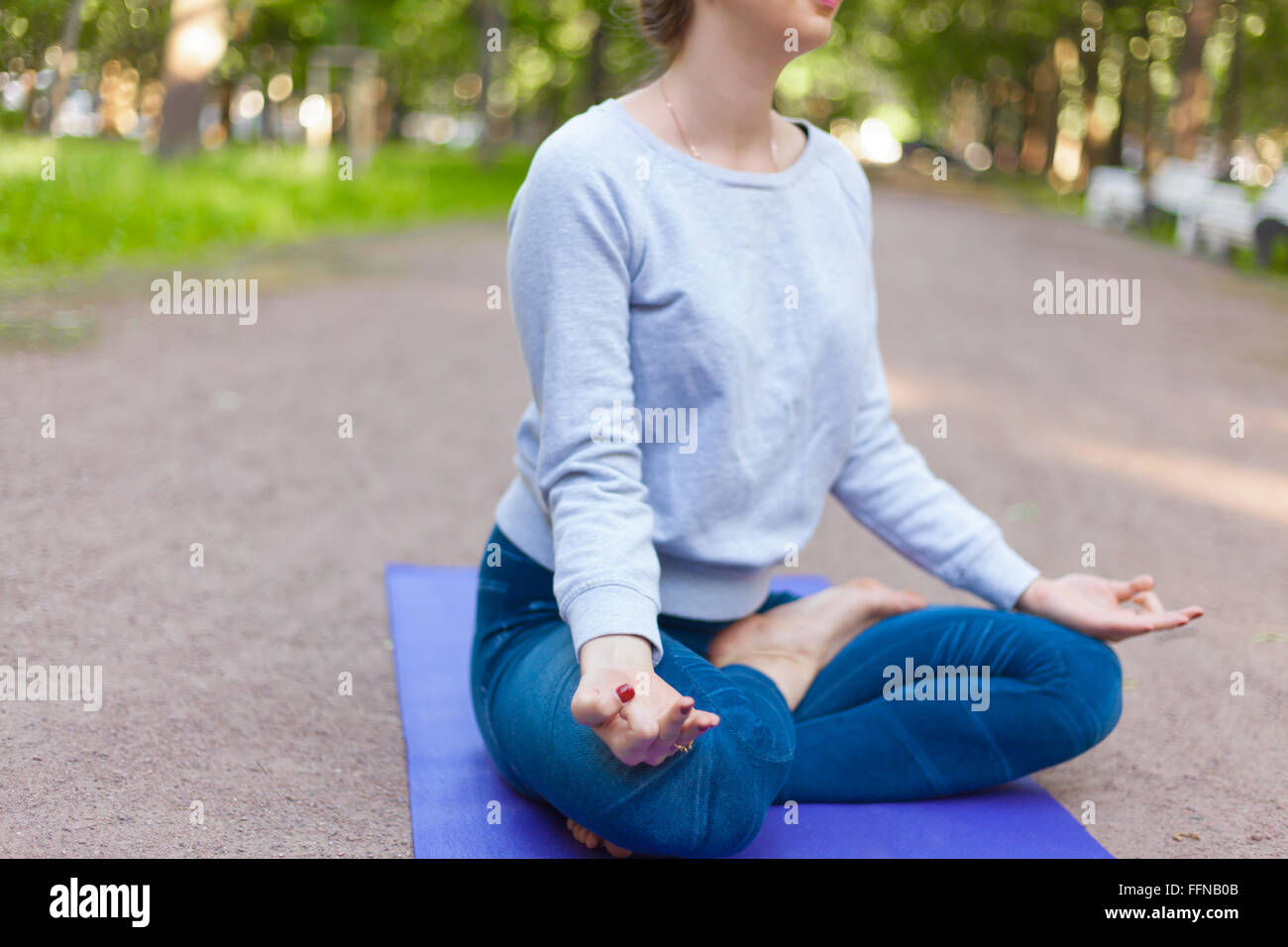 Cross legged yogic posture hi-res stock photography and images - Alamy