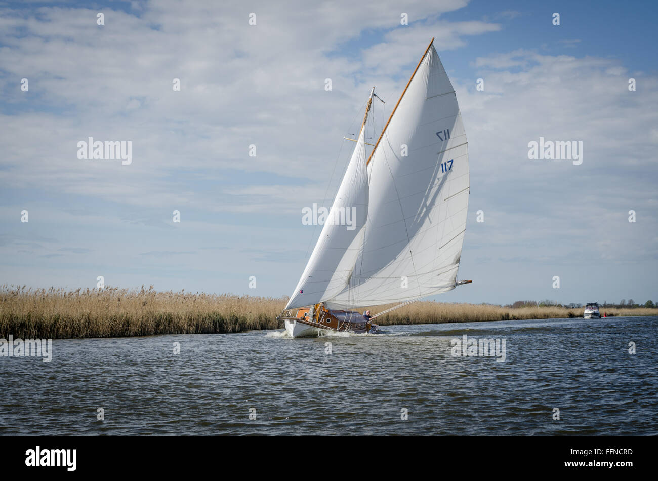 A boat sailing on the river Bure inthe Norfolk Broads Stock Photo - Alamy