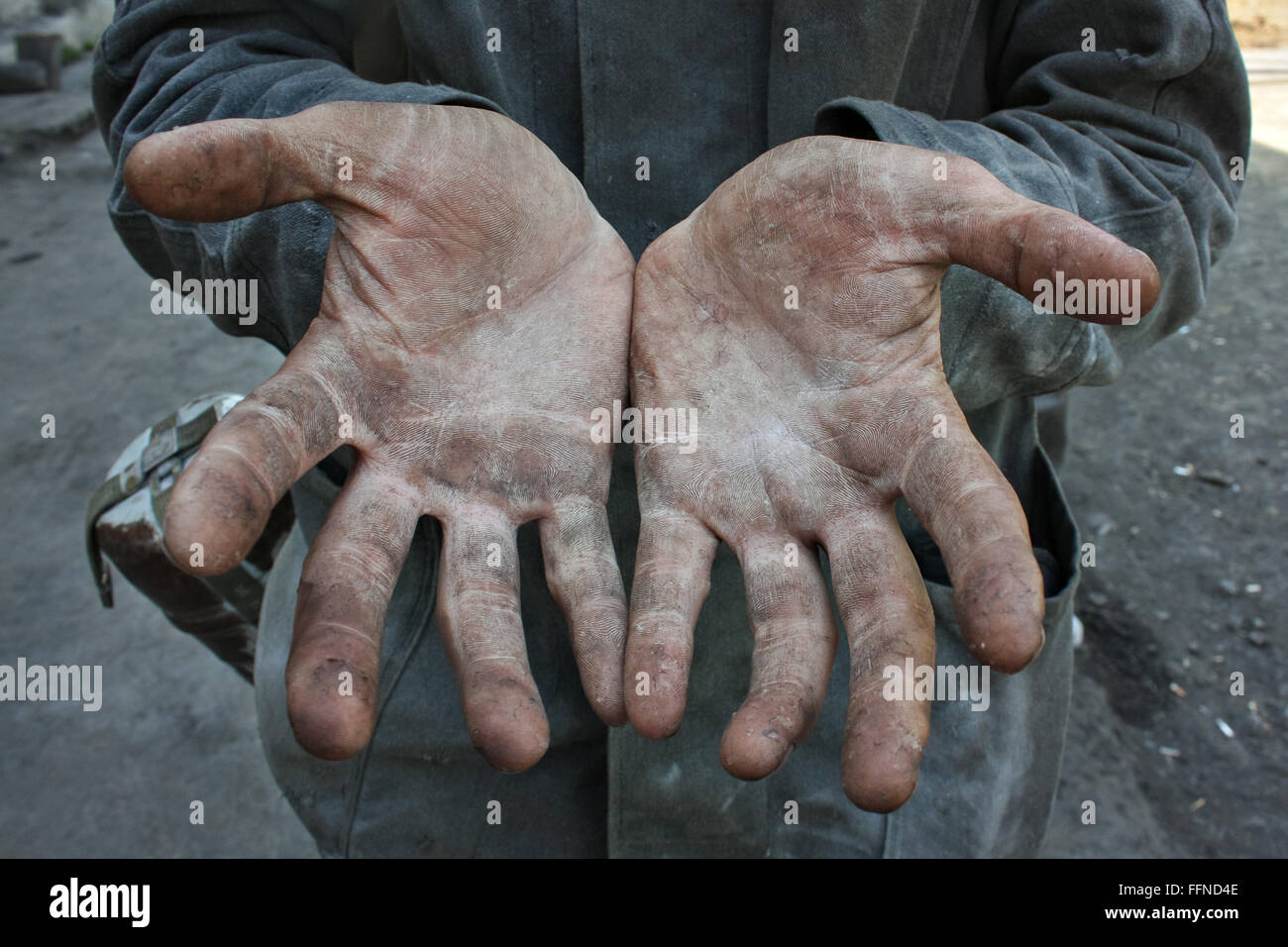 Worker Man with Dirty Hands Stock Photo - Alamy
