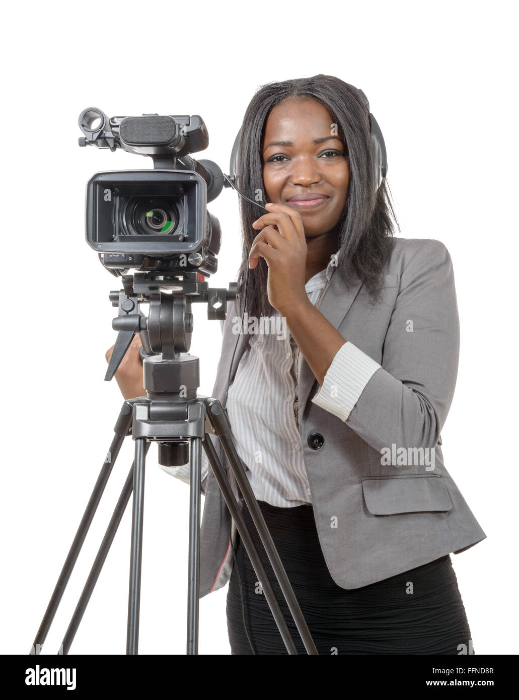 a young African American women with professional video camera and ...