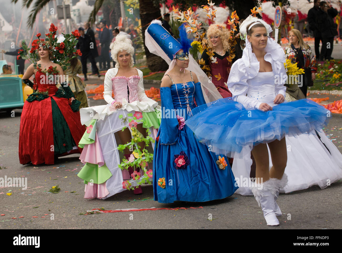 Performers dressed in elaborate colourful costumes taking part in the ...