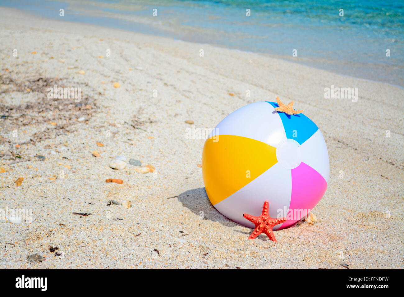 beach ball by a turquoise shore in sardinia Stock Photo - Alamy